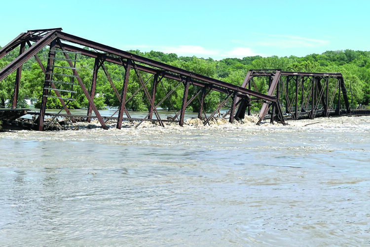 Flooding collapses a bridge, forces evacuations and kills 1 | News ...
